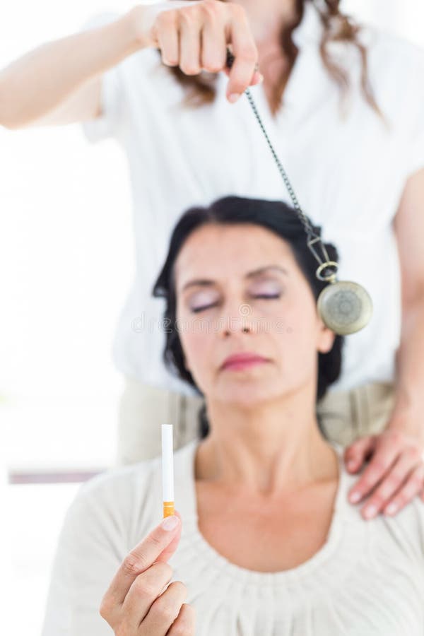 Woman Being Hypnotized To Quit Smoking Stock Photo - Image of hypnosis ...