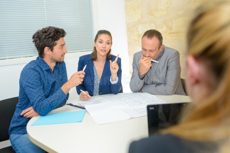 Woman Being Interviewed by Three People Stock Image - Image of ...