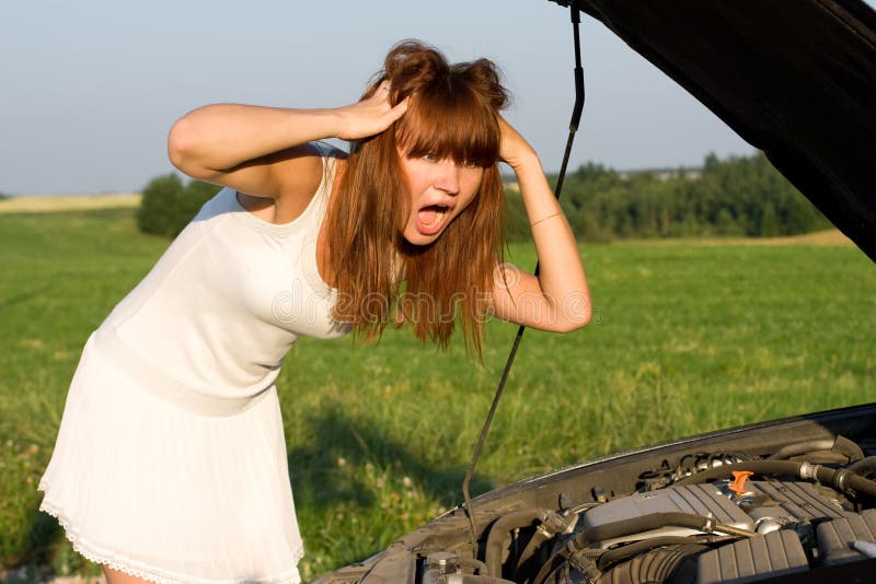 Woman bent over car engine stock image. Image of driveway - 31960963