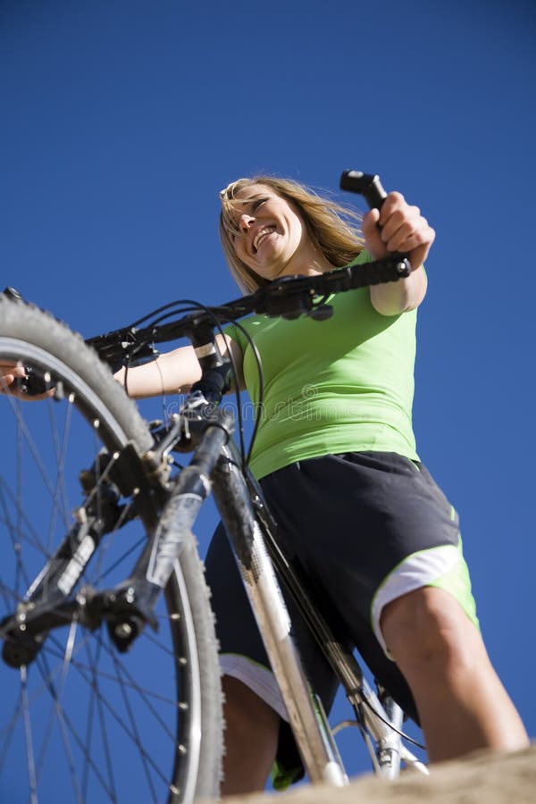 Woman on bike low view stock image. Image of caucasian - 11518177