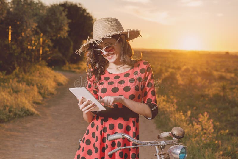 Woman with Bike Reading Emails on Her Tablet Stock Photo - Image of ...