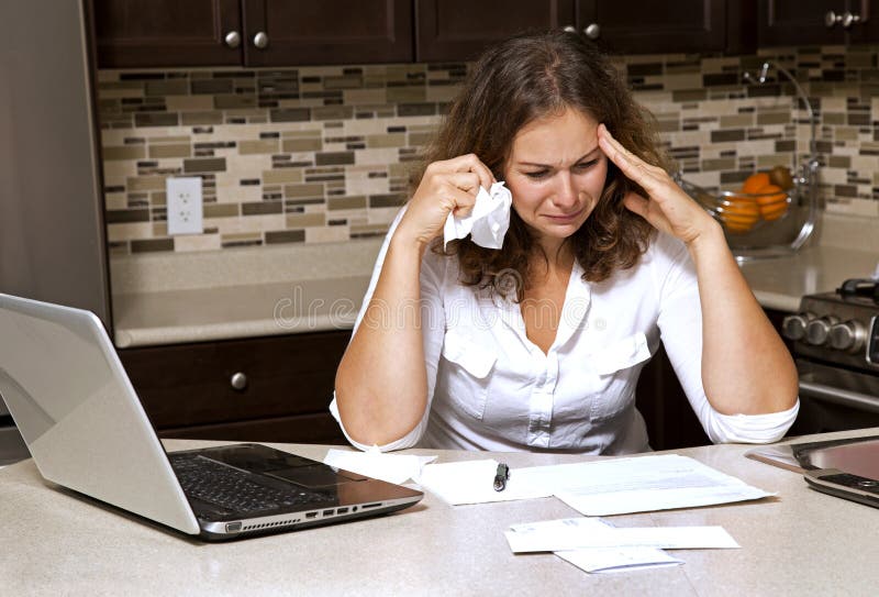 Stressed Woman Looking Down Bills Stock Photos - Free & Royalty-Free ...