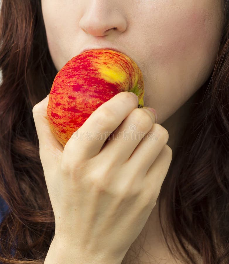 Woman biting an apple stock image. Image of nutritious - 38009607