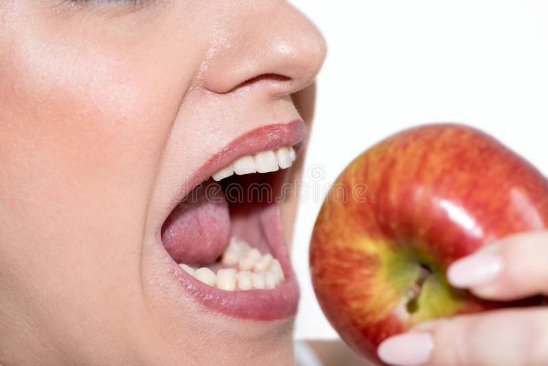 Woman biting an apple stock photo. Image of fresh, biting - 133418206
