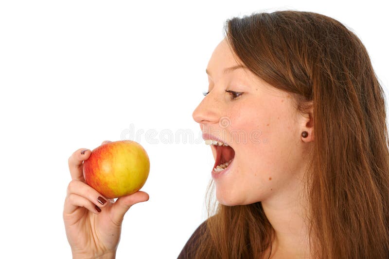 Woman is biting in a apple stock image. Image of beautiful - 35231771