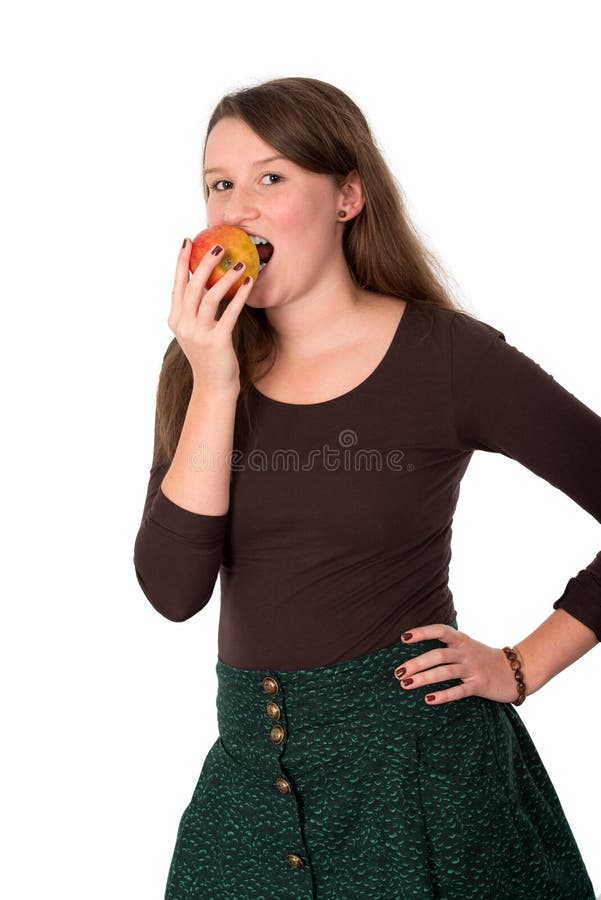Woman is biting in a apple stock image. Image of brunette - 36146155