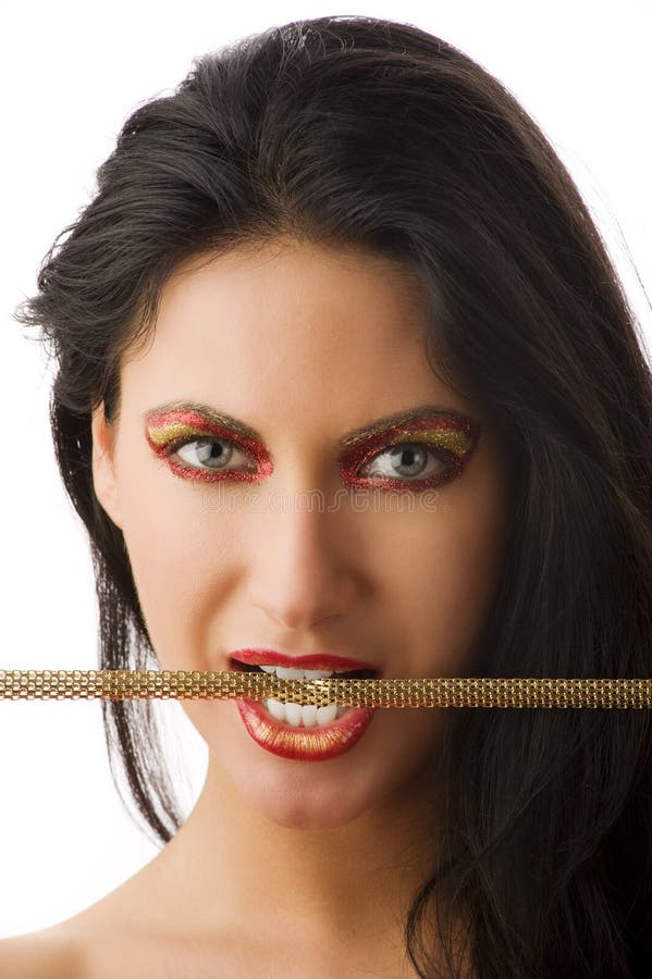 Woman biting gold necklace stock photo. Image of creative - 10763248