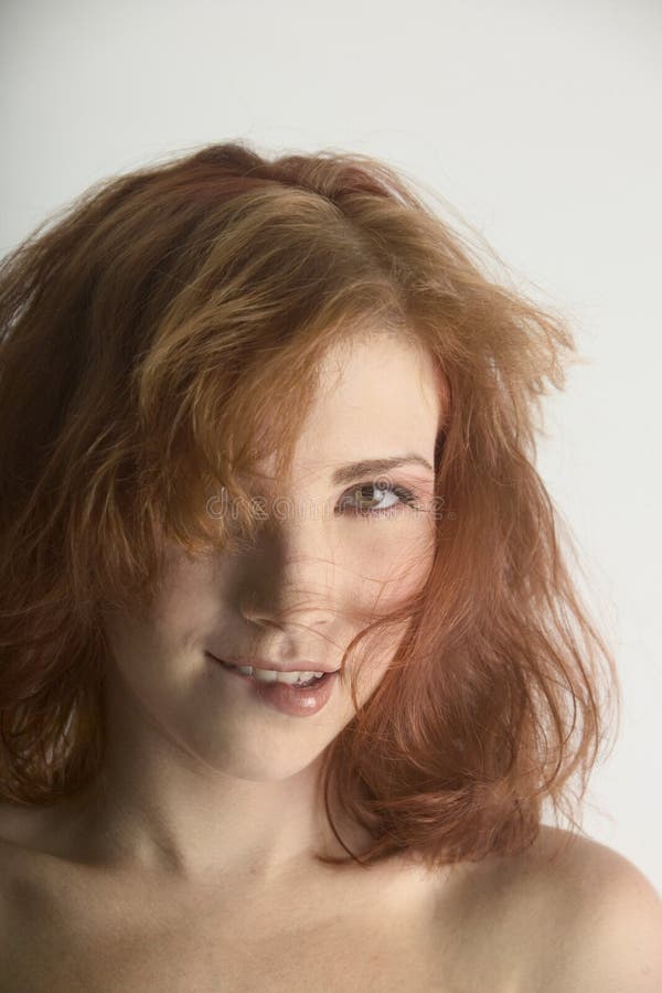 Woman Biting Her Lip with Mussed Hair Stock Photo - Image of woman ...