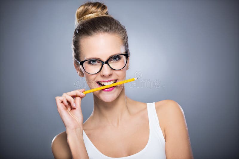 Woman biting a pencil stock photo. Image of people, adult - 57229904