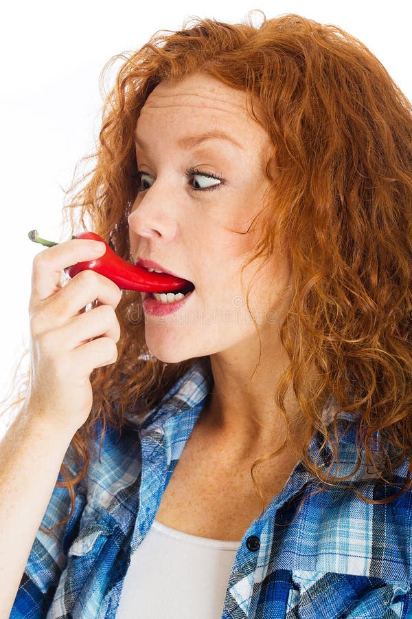 Woman biting red pepper stock image. Image of chili, hair - 28837255