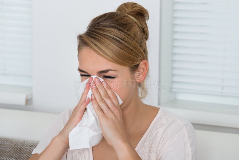 Woman Blowing Nose while Suffering from Cold Stock Photo - Image of ...