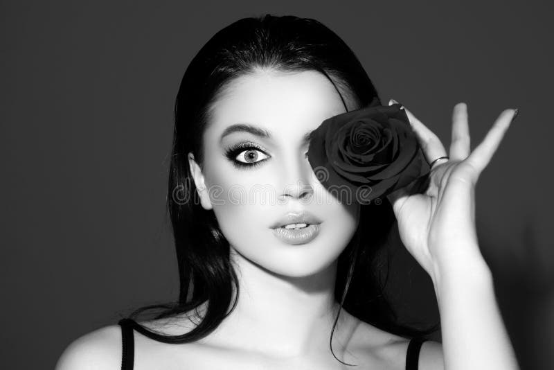 Woman With Blue Eyes And Red Rose Flower Fashion Beauty Portrait On