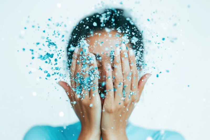Woman Covering Face with Hands while Blue Glitter Explodes Around Her ...