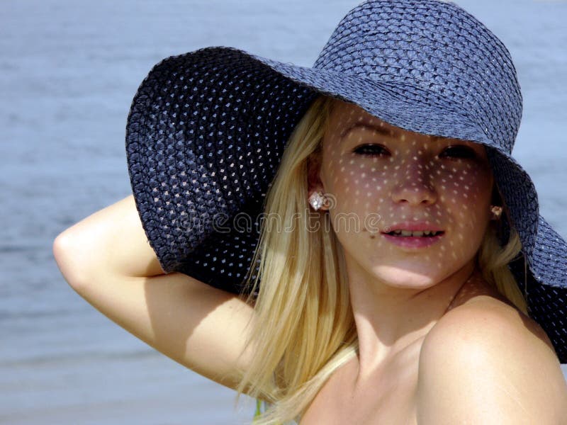Woman in blue hat stock image. Image of beach, female - 10803959