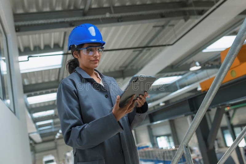 Woman with Blue Helmet, an Engineering Programmer at a Factory Looking ...