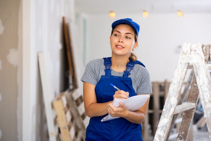 Woman in Blue Overalls Checking Completed Construction Work on Drawing ...