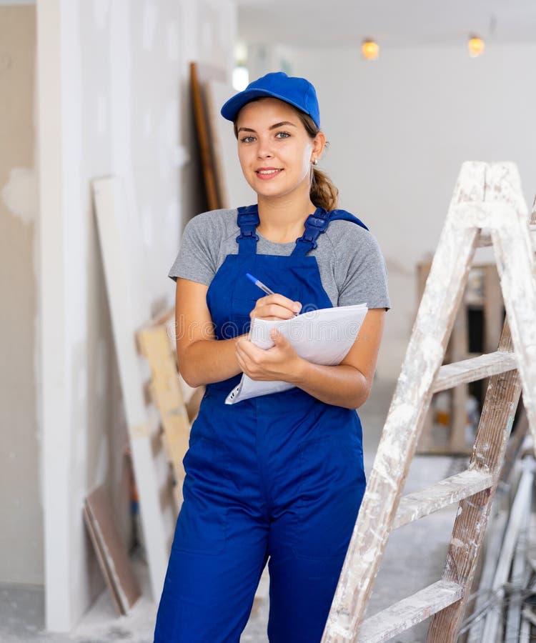Woman in Blue Overalls Checking Completed Construction Work on Drawing ...