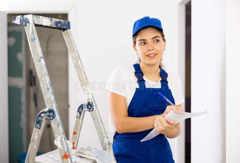 Woman Blue Overalls Checks Completed Construction Work Drawing Stock ...