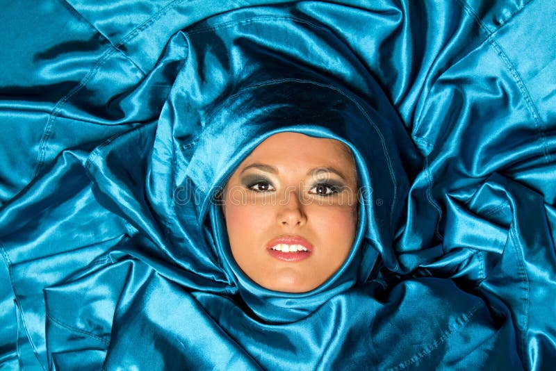 Woman with blue satin stock photo. Image of biracial - 15804446