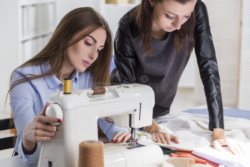 Woman Sewing Her Colleague Side Pattern Stock Photos - Free & Royalty ...