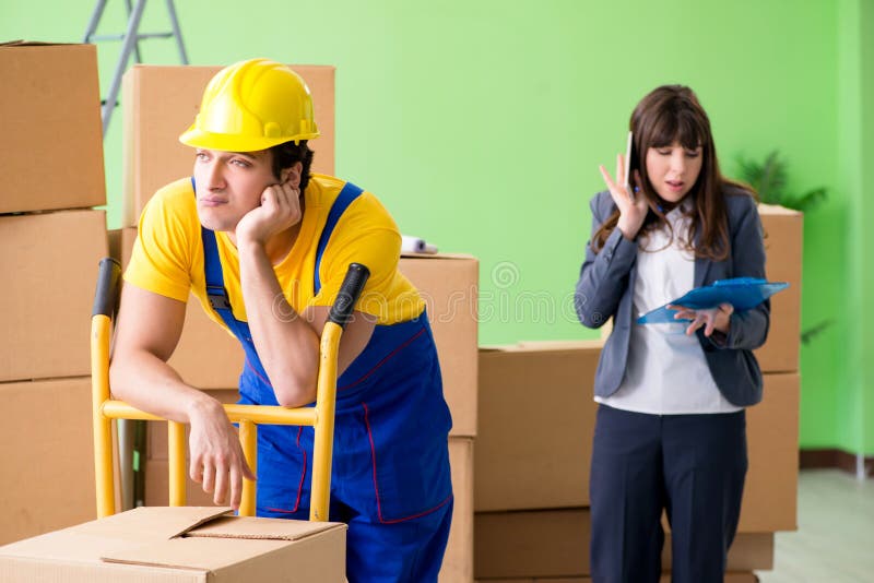 The Woman Boss and Man Contractor Working with Boxes Delivery Stock ...