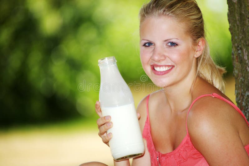 Woman with a Bottle of Milk Stock Image - Image of dairy, eyes: 39662203
