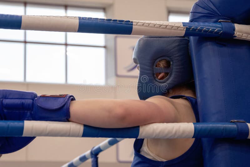 A Woman in a Boxing Uniform Holding the Ropes of the Ring Stock Image ...