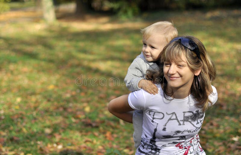 Woman with a Boy on the Back Stock Image - Image of funny, cute: 21772957