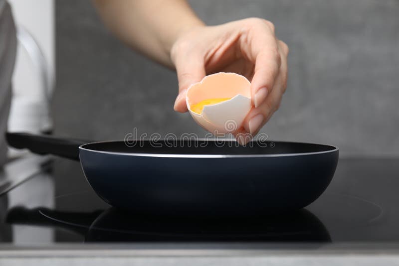 Woman Breaking Egg into Frying Pan, Closeup Stock Image - Image of diet ...