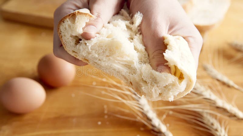 Woman Breaking in Half Fresh Baked Bread Stock Video - Video of ...