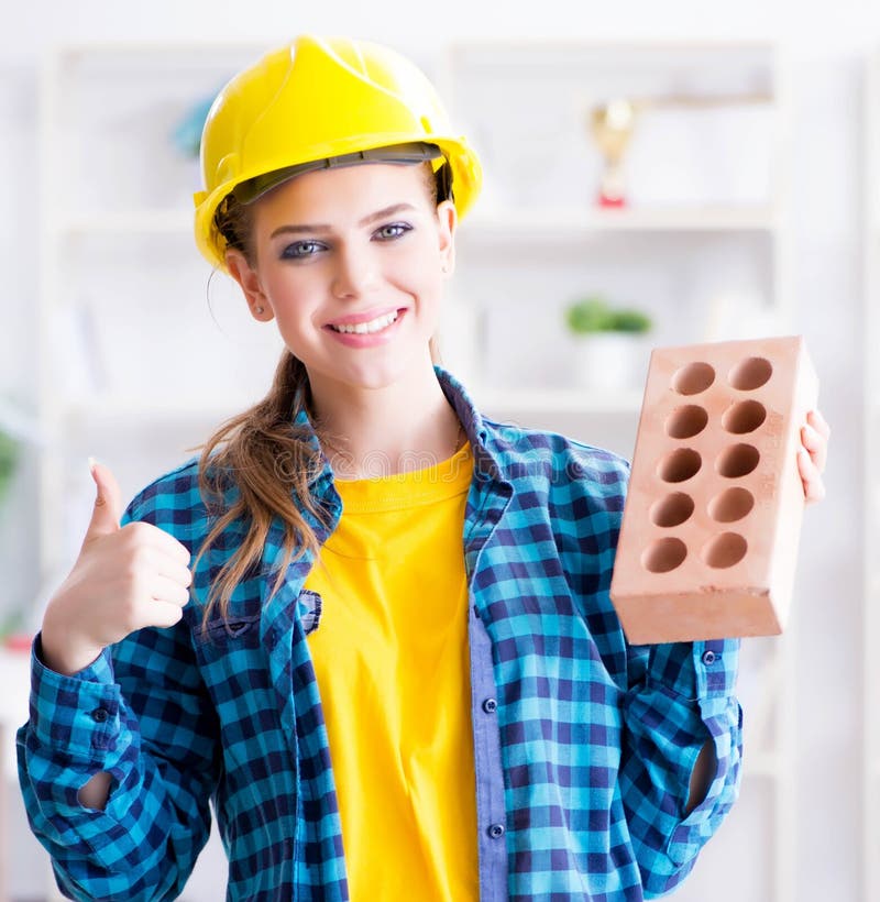 The Woman with Brick in Construction Concept Stock Image - Image of ...