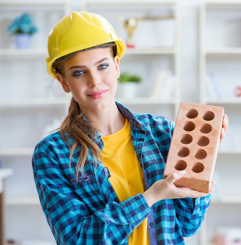 Woman with Brick in Construction Concept Stock Photo - Image of ...
