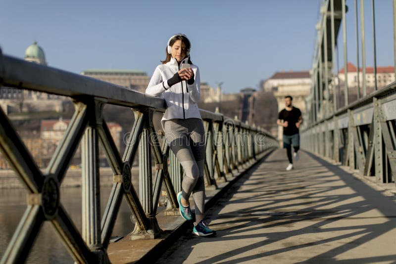 Woman on the Bridge Making a Pause after the Exercise Stock Photo ...