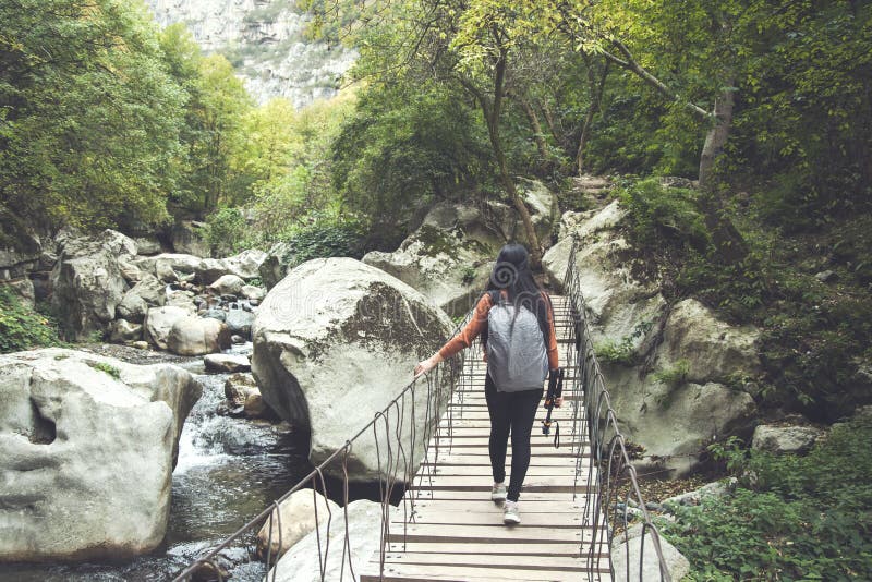 Woman in bridge on river stock photo. Image of wooden - 182046834