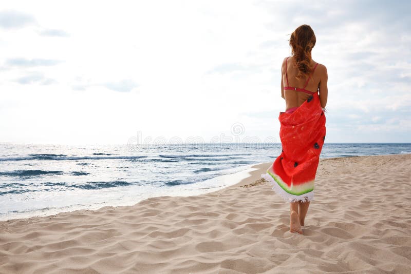 Woman with Bright Beach Towel on Seashore, Back View Stock Image ...