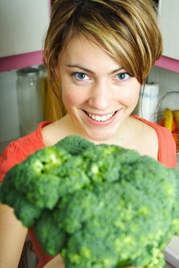 Woman with broccoli stock photo. Image of portrait, happy - 12734940
