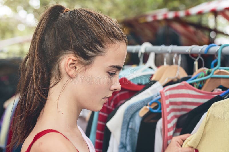 Woman Browsing Clothes on a Flea Market Stock Image - Image of ...