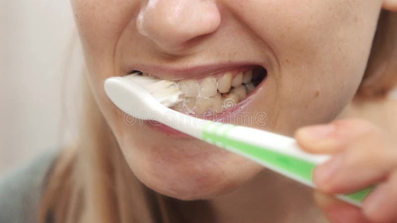 Woman Brushing Her Teeth in a Front of the Mirror Stock Footage - Video ...