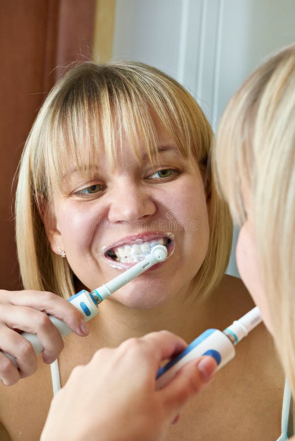 Woman brushing teeth stock photo. Image of health, everyday - 47482192