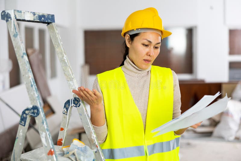 Woman Builder Checking Project Documentation Stock Image - Image of ...