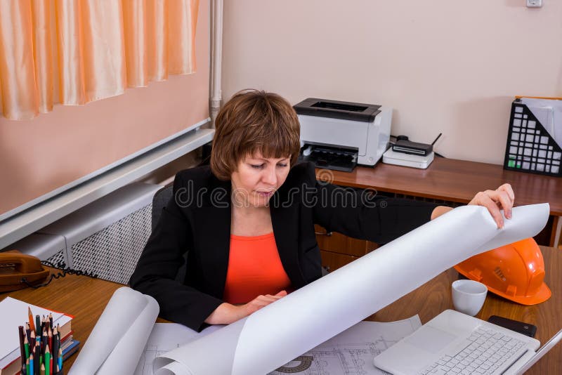 Woman Builder Engineer Looking at Blueprint Paper Stock Image - Image ...