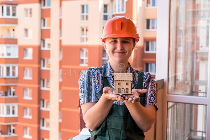 Woman in Builder Helmet Holding House Model and Keys Stock Photo ...
