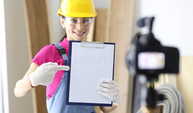 Woman Builder Holding Documents in Hands and Shooting Video on Camera ...