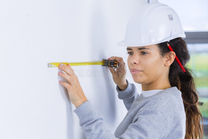 Woman Builder Measuring Wall Stock Image - Image of vocation, helmet ...