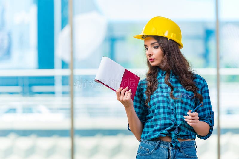 The Woman Builder Taking Notes at Construction Site Stock Photo - Image ...