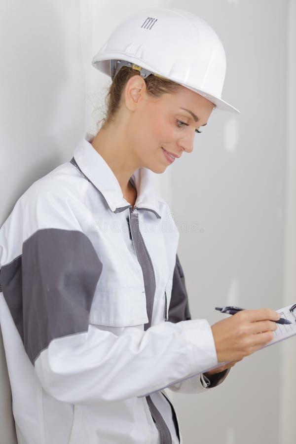 Woman Builder Taking Notes at Construction Site Stock Photo - Image of ...