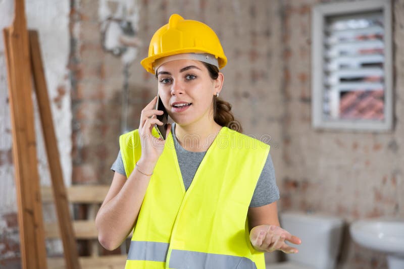 Woman Builder Talking on Phone Construction Site Stock Photo - Image of ...