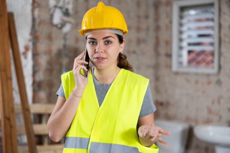 Woman Builder Talking on Phone Construction Site Stock Photo - Image of ...