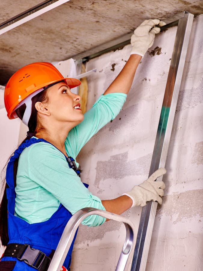 Woman in builder uniform stock photo. Image of helmet - 54227108