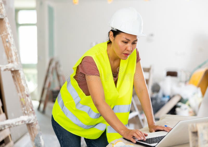 Builder Using Phone. Portrait of Builder Man. Construction Worker with Hardhat Helmet on ...